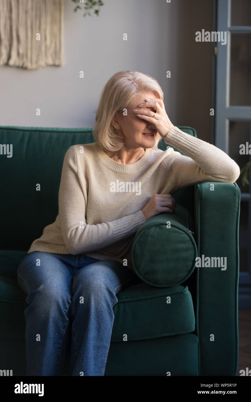 Sad elderly woman crying feeling lonely at home Stock Photo - Alamy