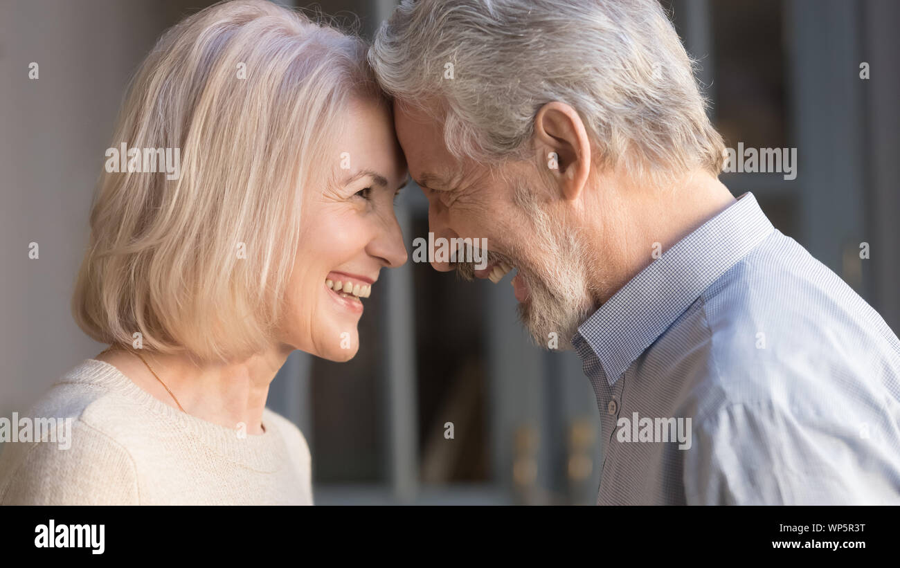 Happy mature couple touch foreheads enjoying romantic moment Stock ...