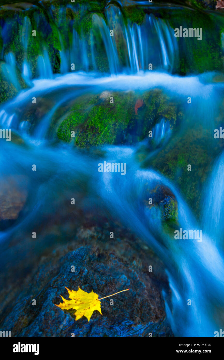 Small stream running through stones during fall foliage, Stowe, Vermont ...