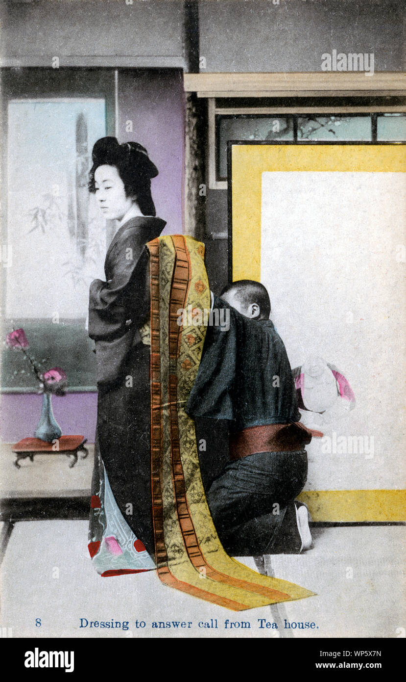 [ 1920s Japan - Geisha Getting Dressed ] — An assistant helps a geisha ...
