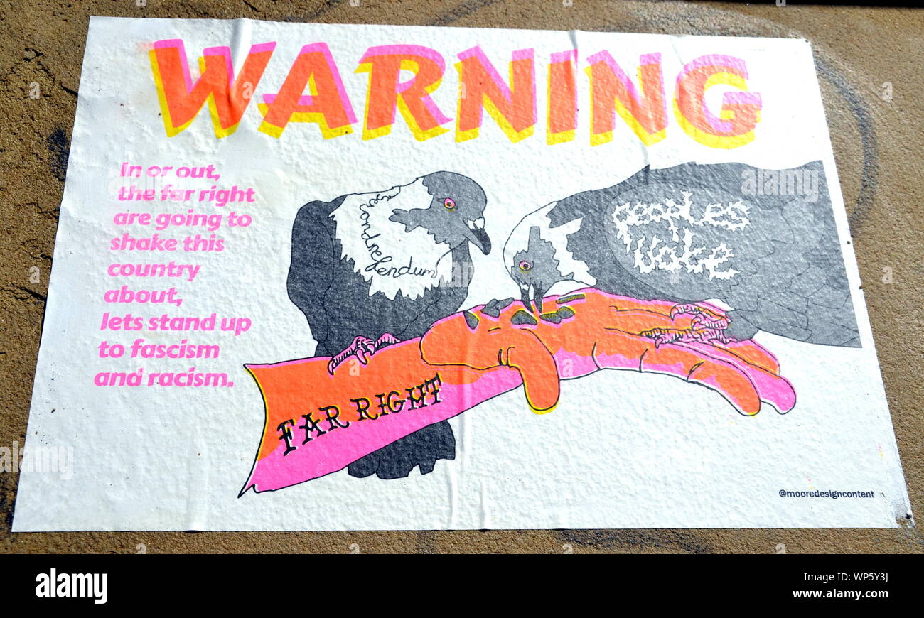 An anti-racist and anti-fascist poster on a wall in central Manchester ...