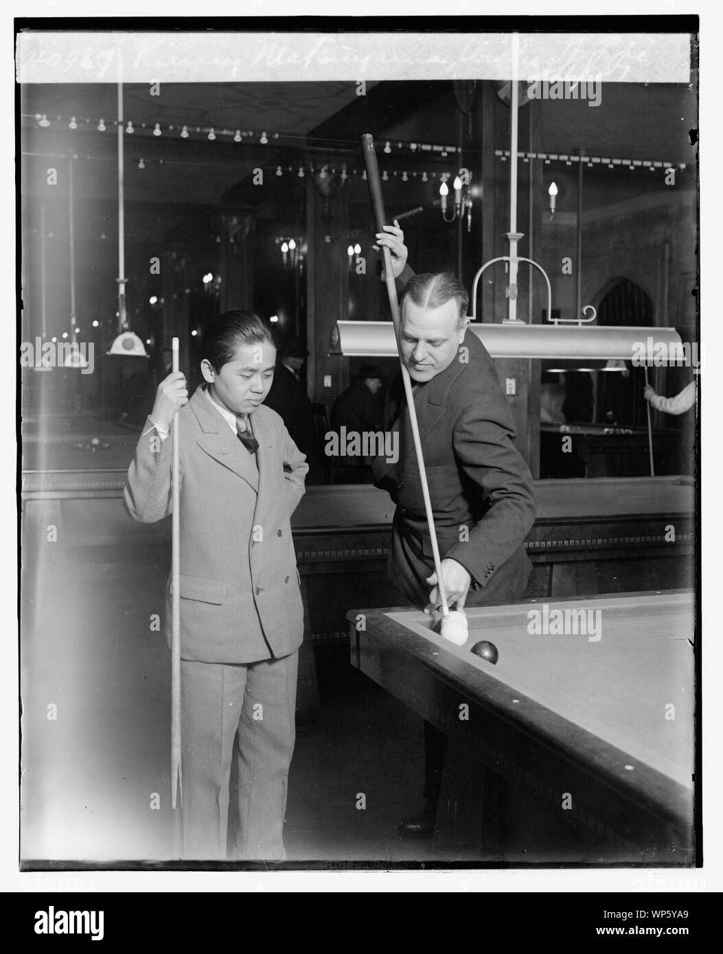 Carom billiards players Kinrey Matsuyama (standing left) & Willie Hoppe ...