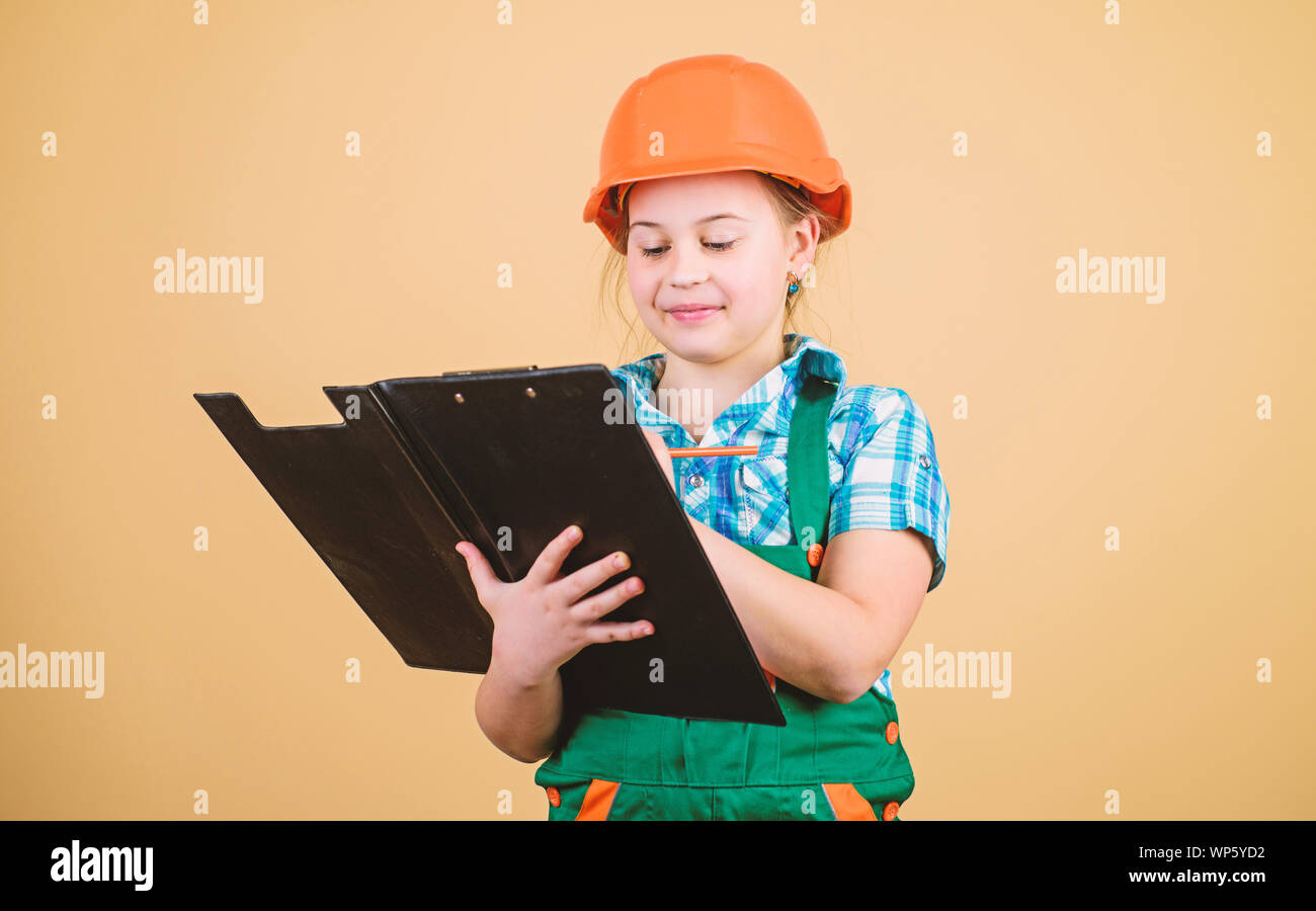 Builder engineer architect. Kid worker in hard hat. small girl ...