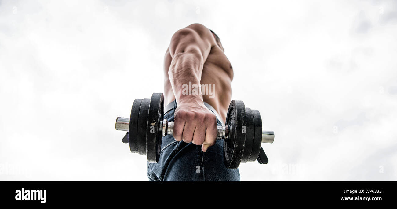 Anabolic steroids types uses and risks. Muscular man exercising with ...