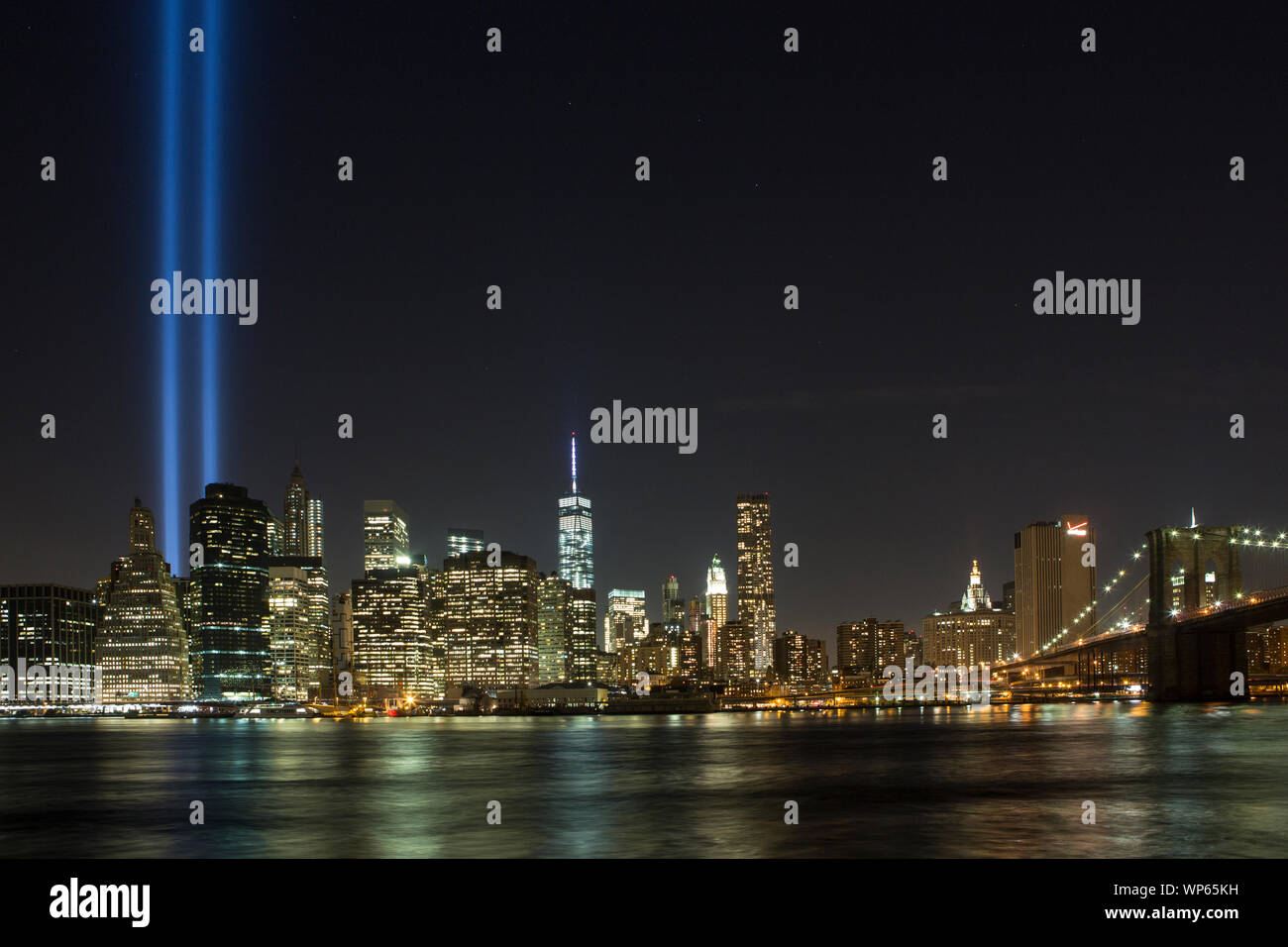Manhattan skyline and the Freedom Tower at night, seen from Brooklyn ...