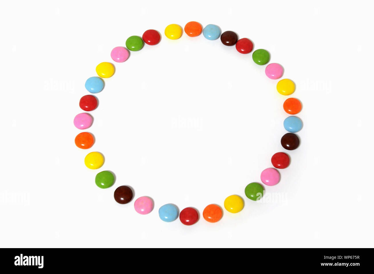 circle of colorful chocolate candy spread on white background Stock ...