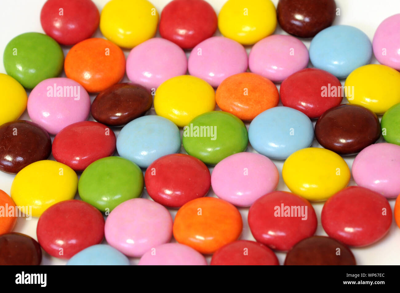 colorful chocolate candy spread on white background Stock Photo - Alamy