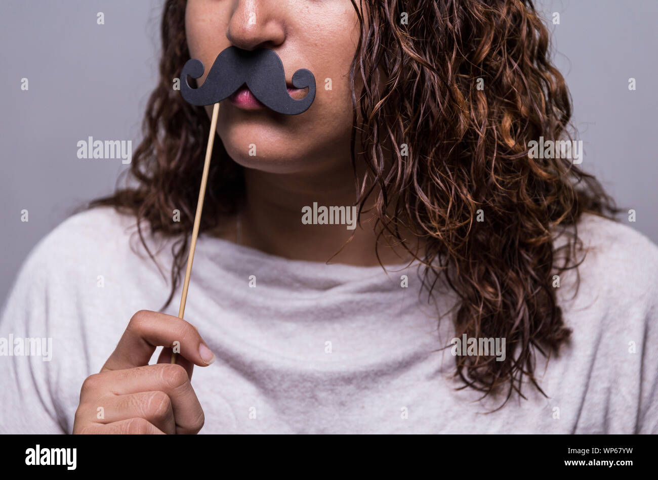 Woman wearing fake moustache hi-res stock photography and images - Alamy