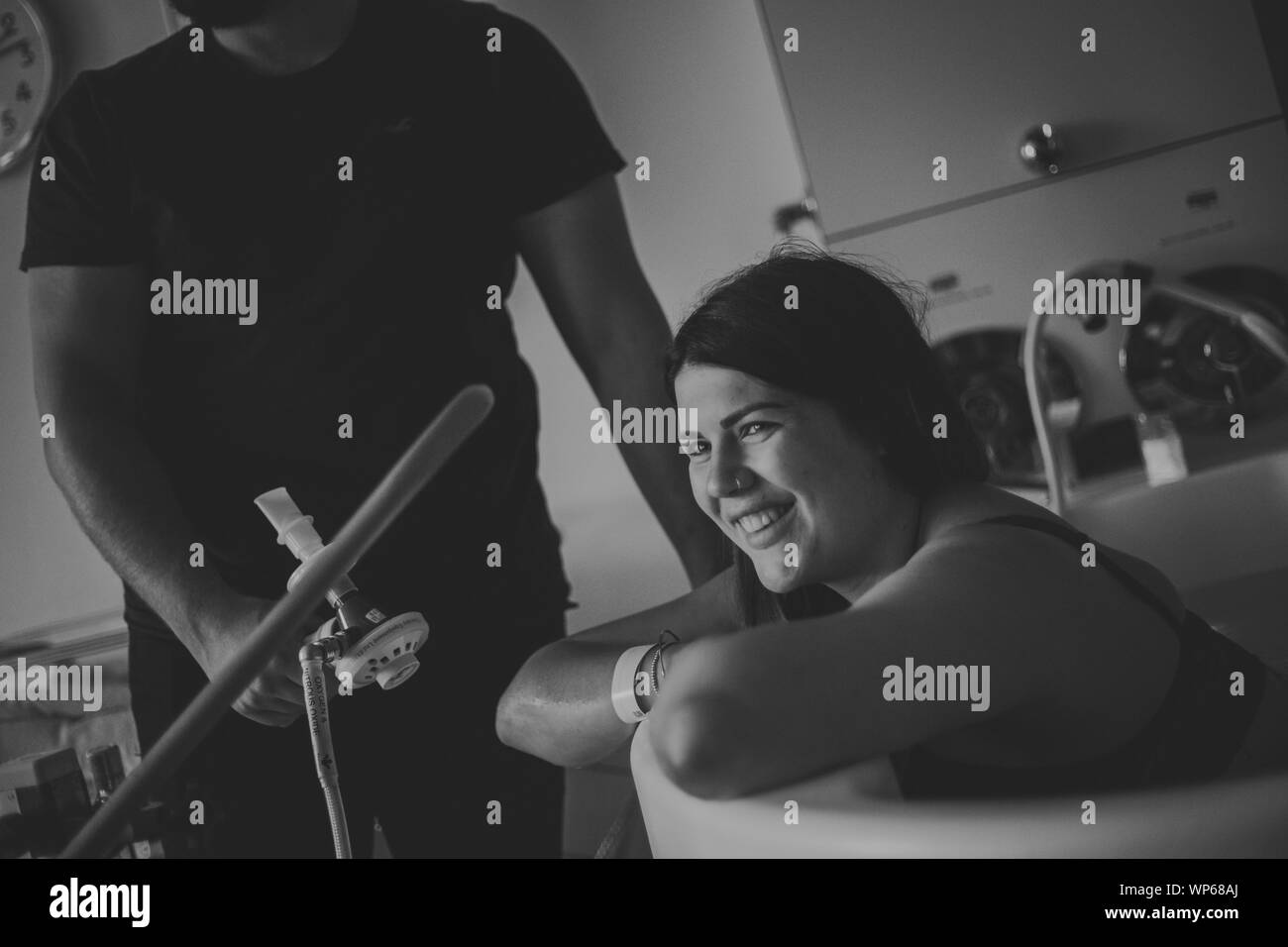 Authentic birth images, woman giving birth in pool Stock Photo - Alamy