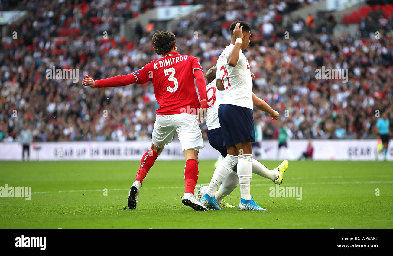 Bulgaria's Kristian Dimitrov (left) fouls England's Harry Kane (centre ...