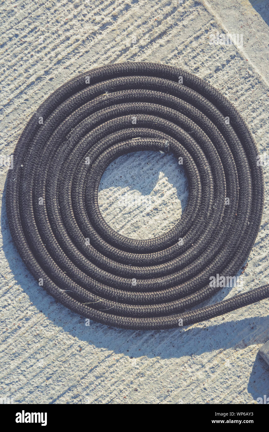 Swirl rope vessel background. Sailing marine spiral rope on the pier ...