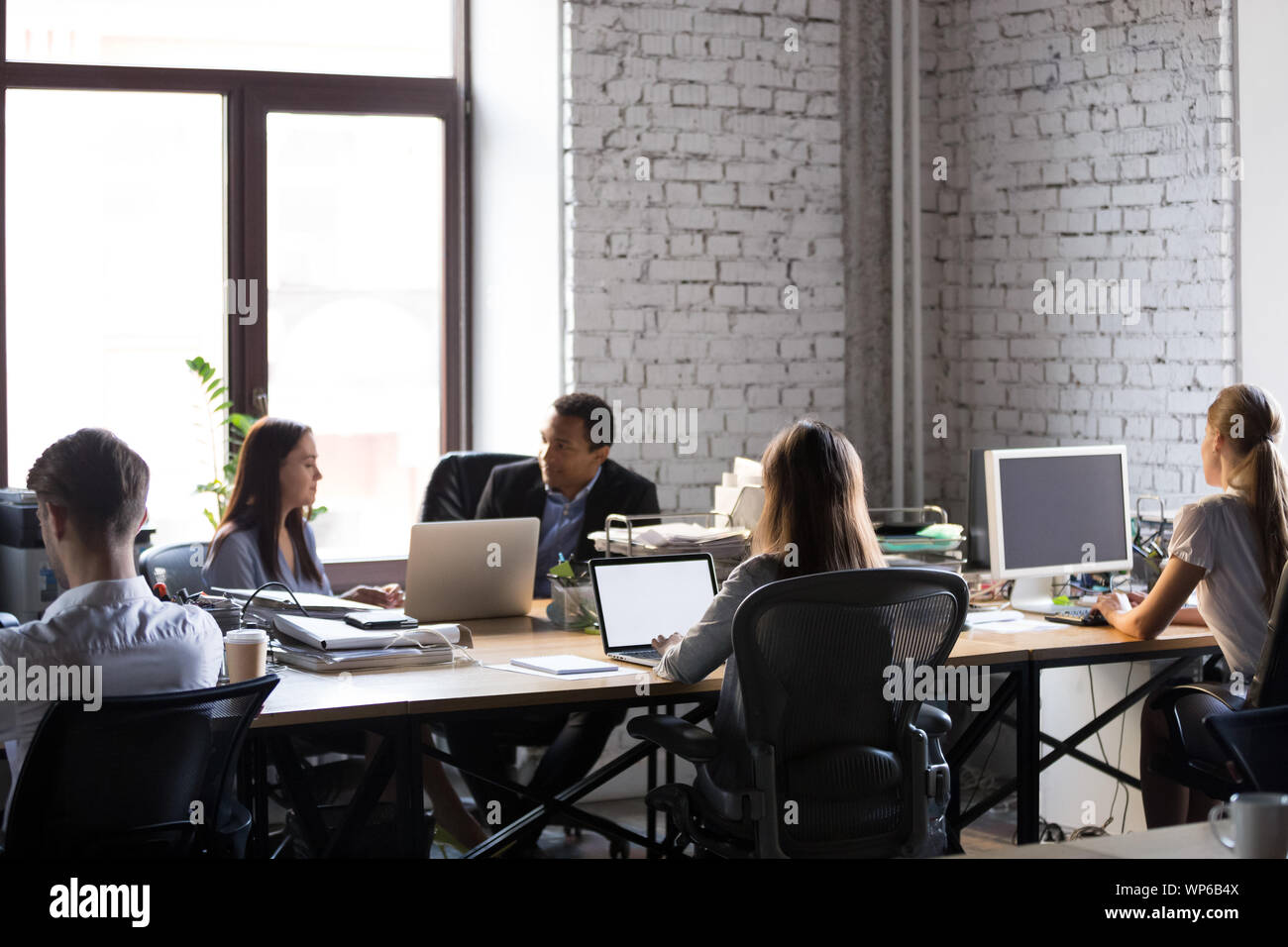 Businesspeople employees working in modern office, using computers ...