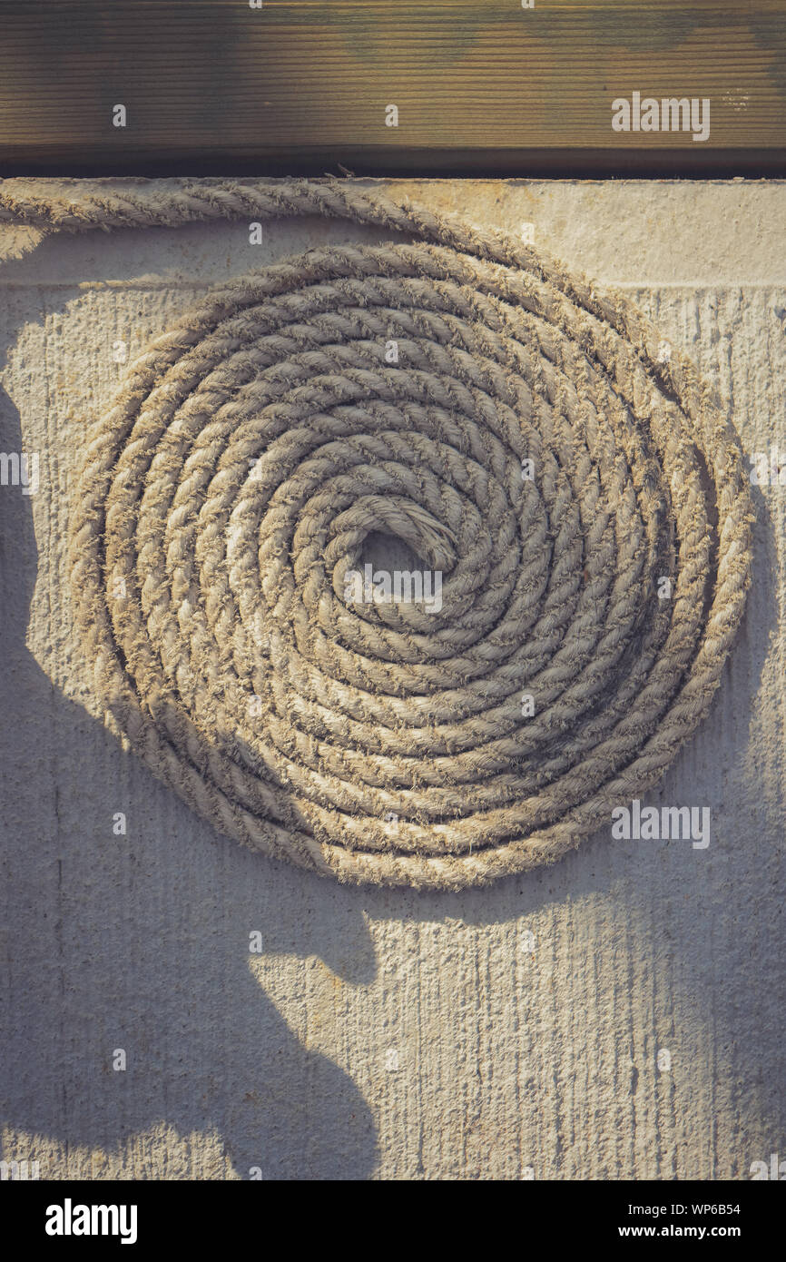 Sailing marine spiral rope on the pier. Rope snail nautical texture ...