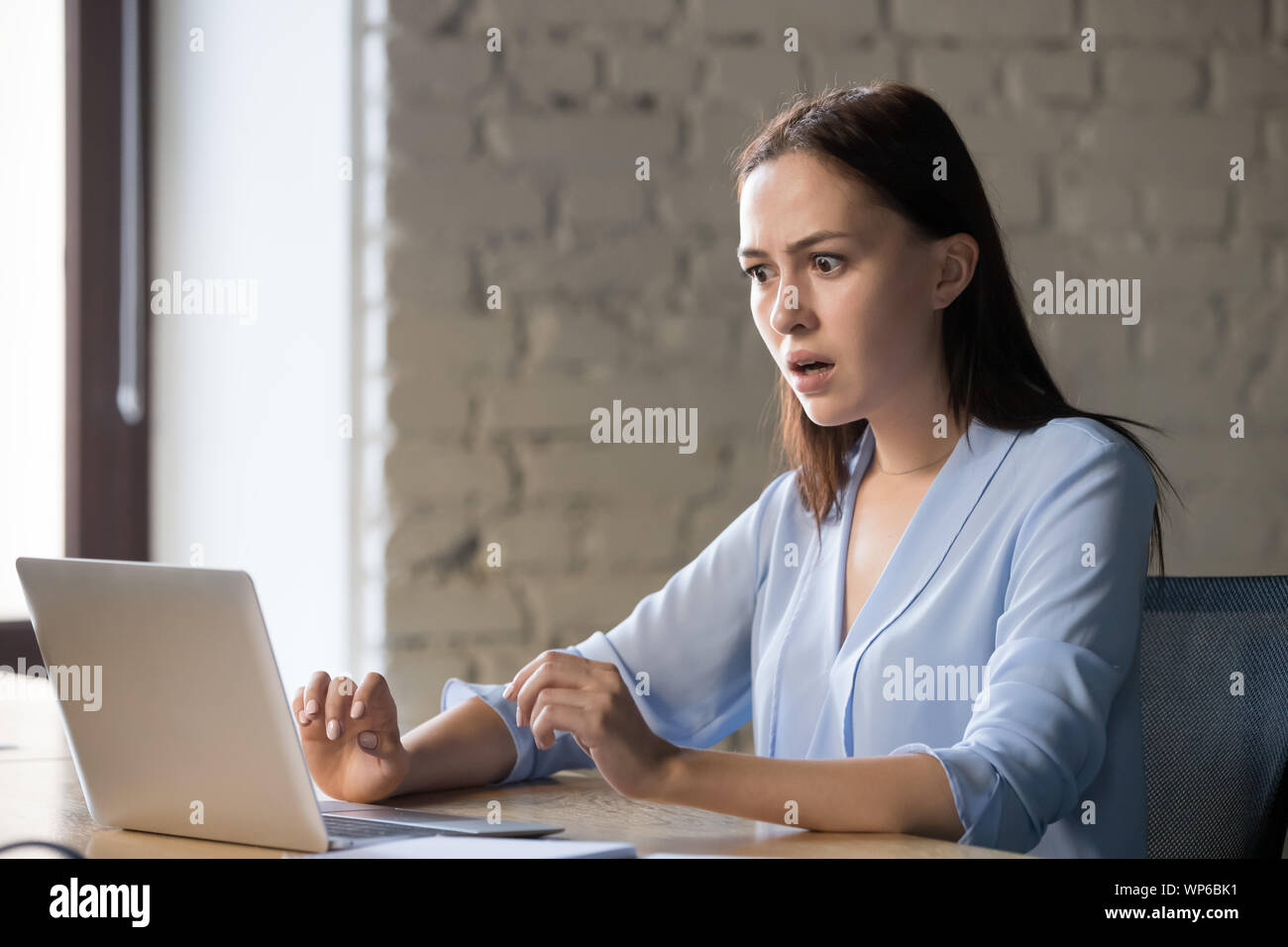 Confused student looking laptop screen hi-res stock photography and ...