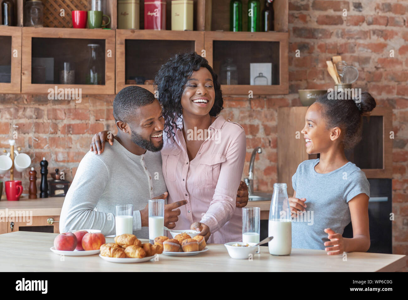 Cheerful african family having healthy breakfast together Stock Photo ...