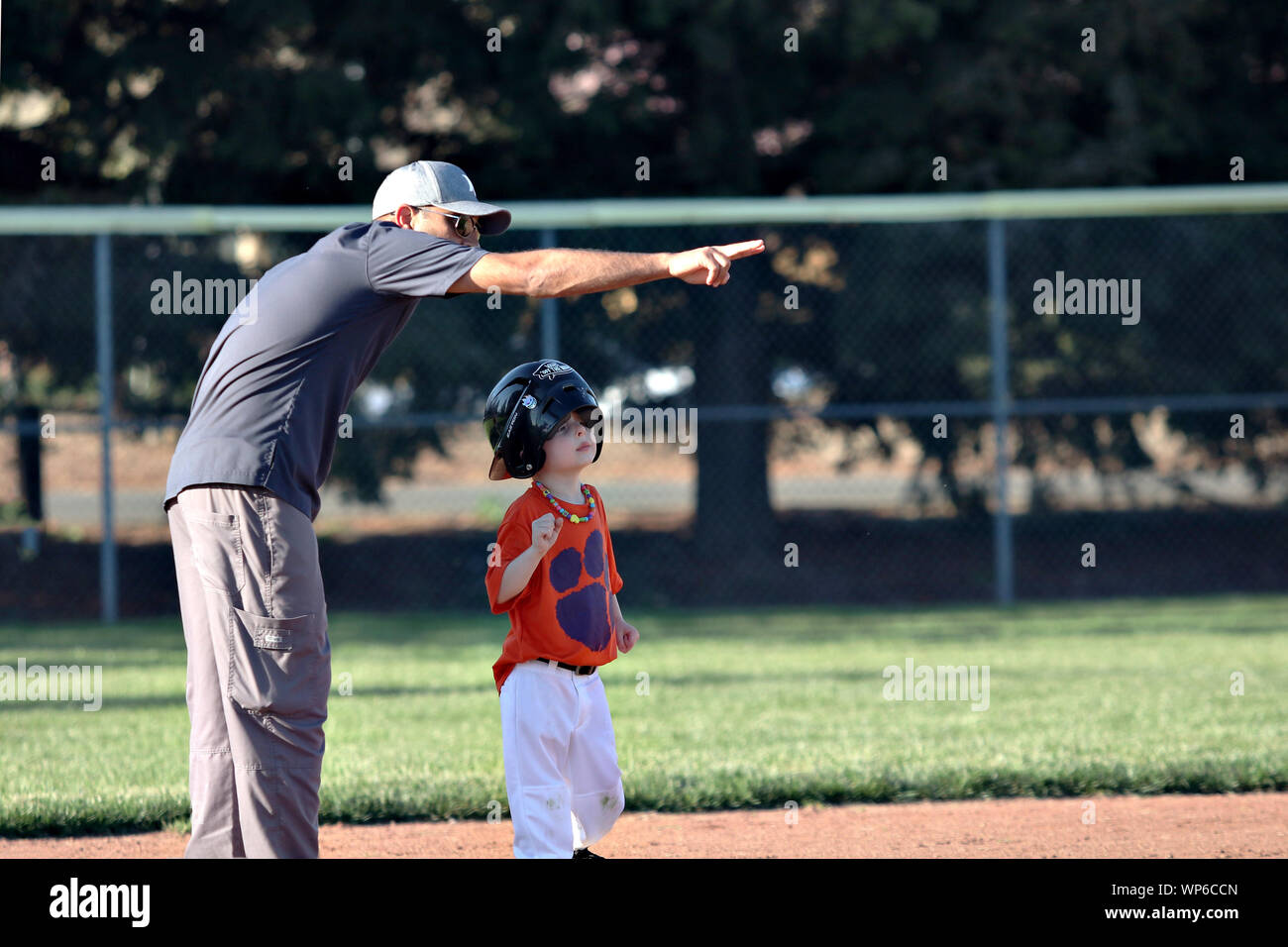 Boy hitting baseball hi-res stock photography and images - Alamy