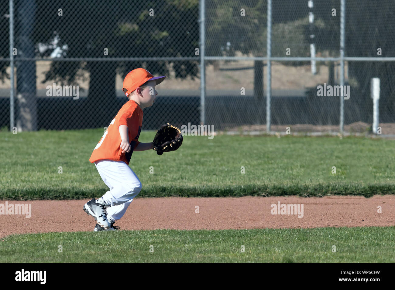 Boy playing baseball dad not watching hi-res stock photography and ...