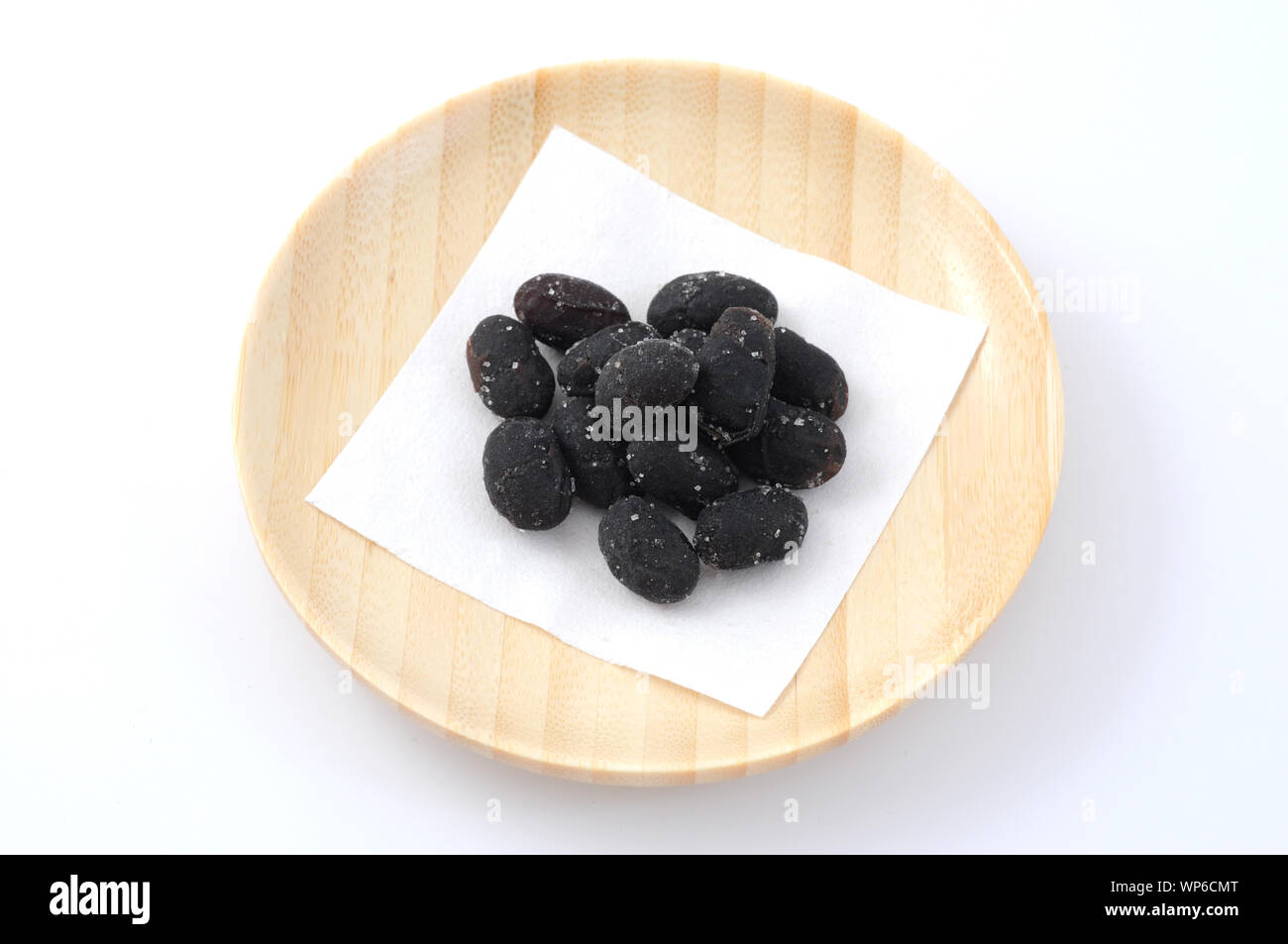 Black Amanatto Japanese confectionery made from beans closeup isolated ...