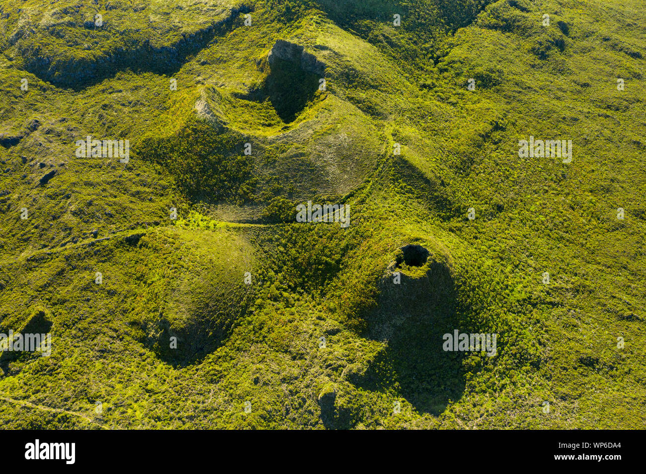 Aerial image of typical green volcanic caldera crater landscape with ...