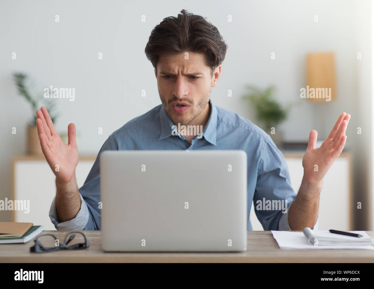 Shocked Man Looking At Laptop Having Problem Working At Home Stock ...