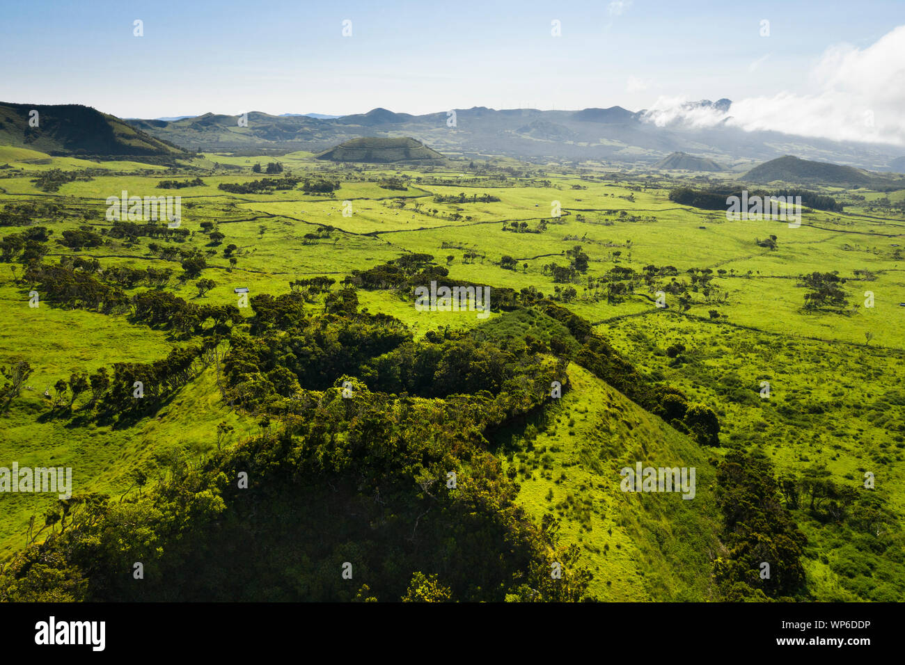 Aerial image of typical green volcanic caldera crater landscape with ...