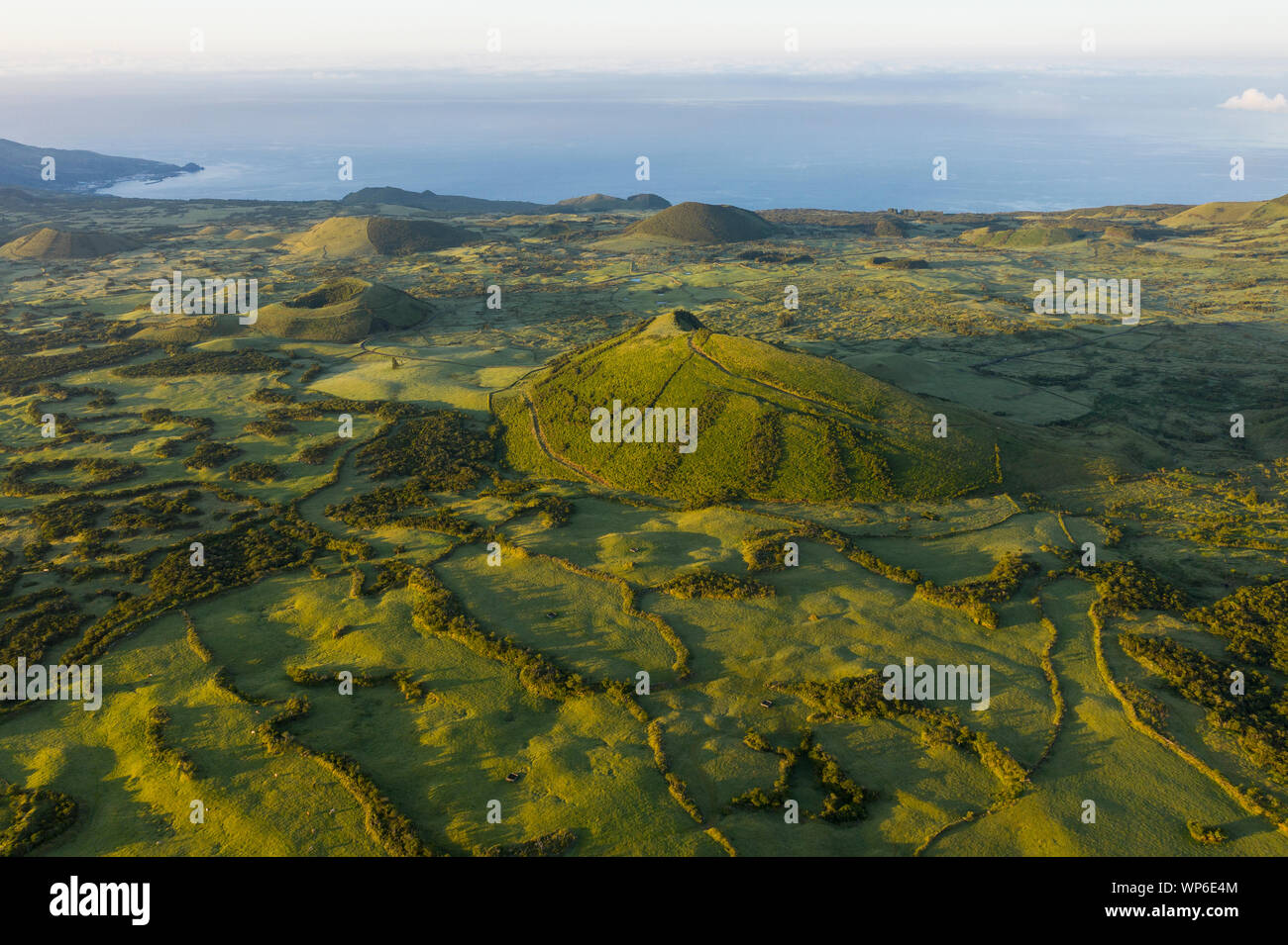 Aerial image of typical green volcanic caldera crater landscape with ...
