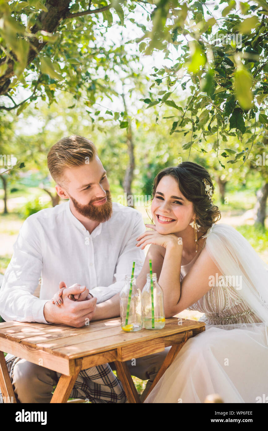 Romantic Couple Sitting At A Table For Two
