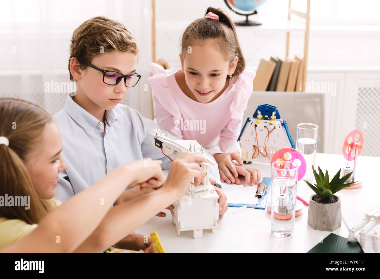 Stem education. Children creating robots at school Stock Photo - Alamy