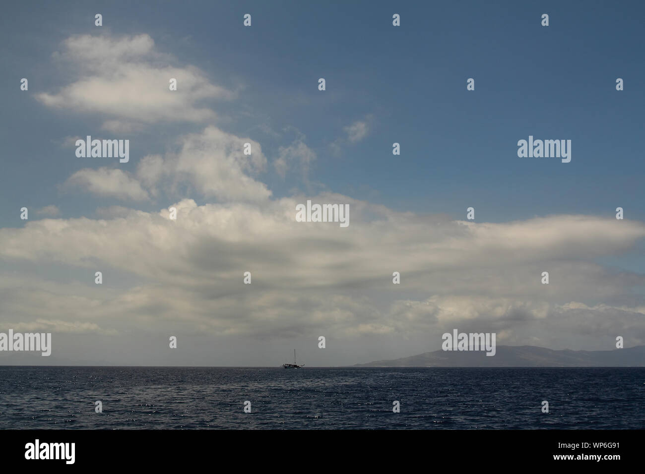 Boat racing across open ocean water. Boat speeding in the sea. Minimal ...
