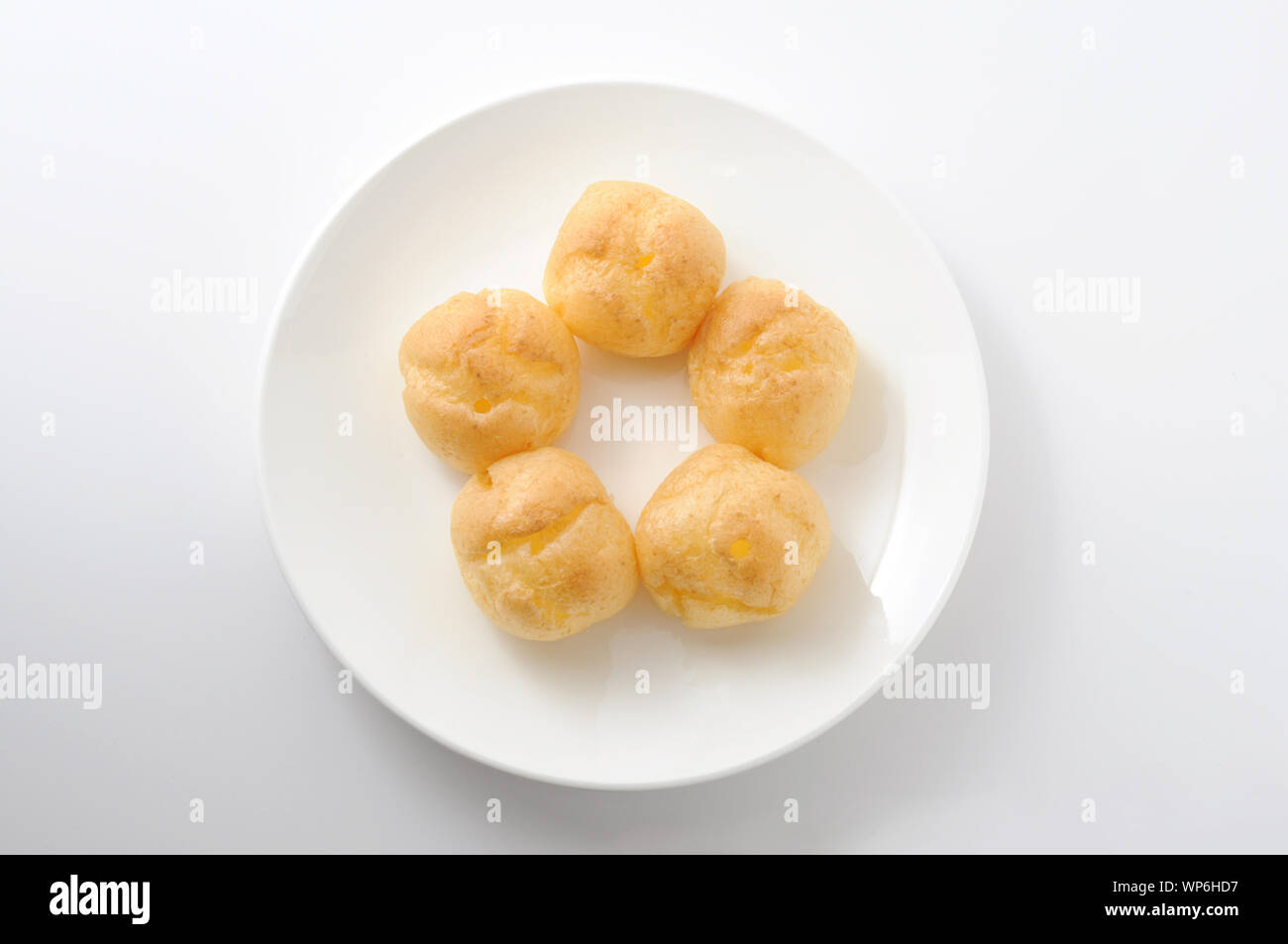 cream puffs closeup isolated on white background Stock Photo - Alamy