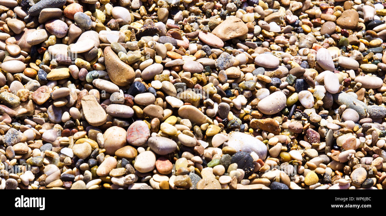 Beach colorful pebbles close up panorama background Stock Photo - Alamy