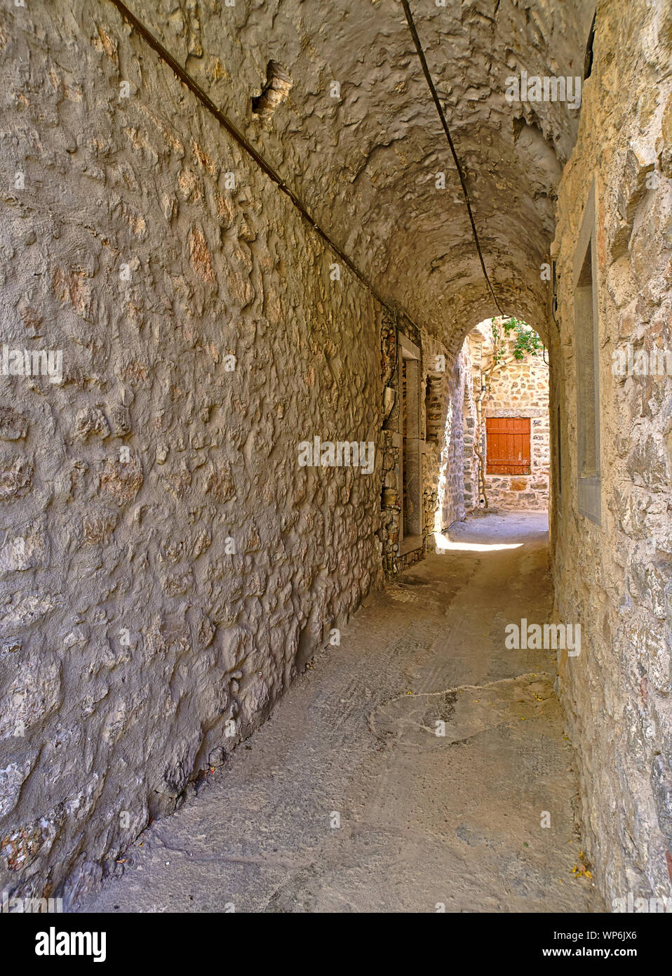 Narrow alley at the medieval castle village of Mesta in Chios island ...