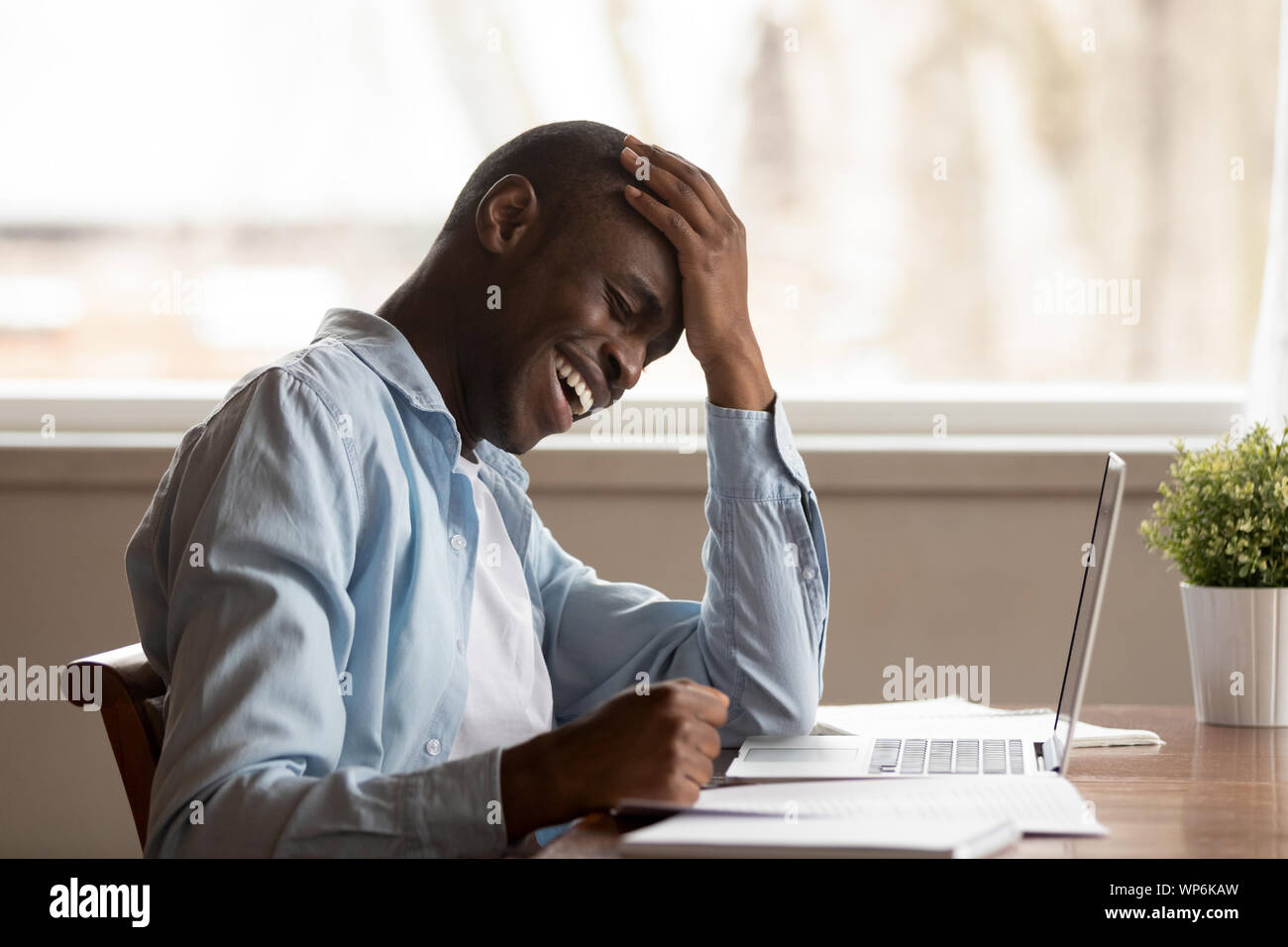 Male Student Laughing Computer Stock Photos & Male Student Laughing ...