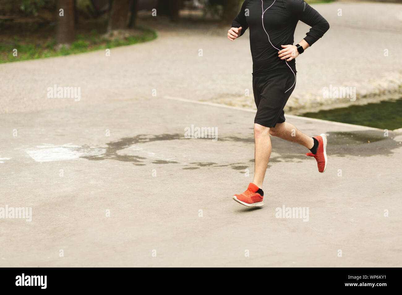 Man running watch park hi-res stock photography and images - Alamy