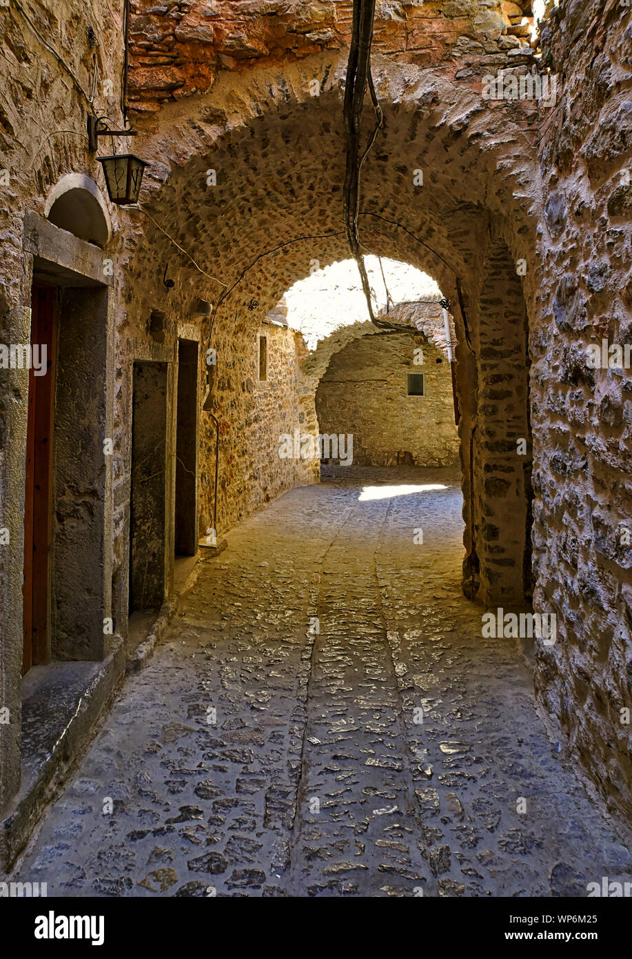 Narrow alley at the medieval castle village of Mesta in Chios island ...