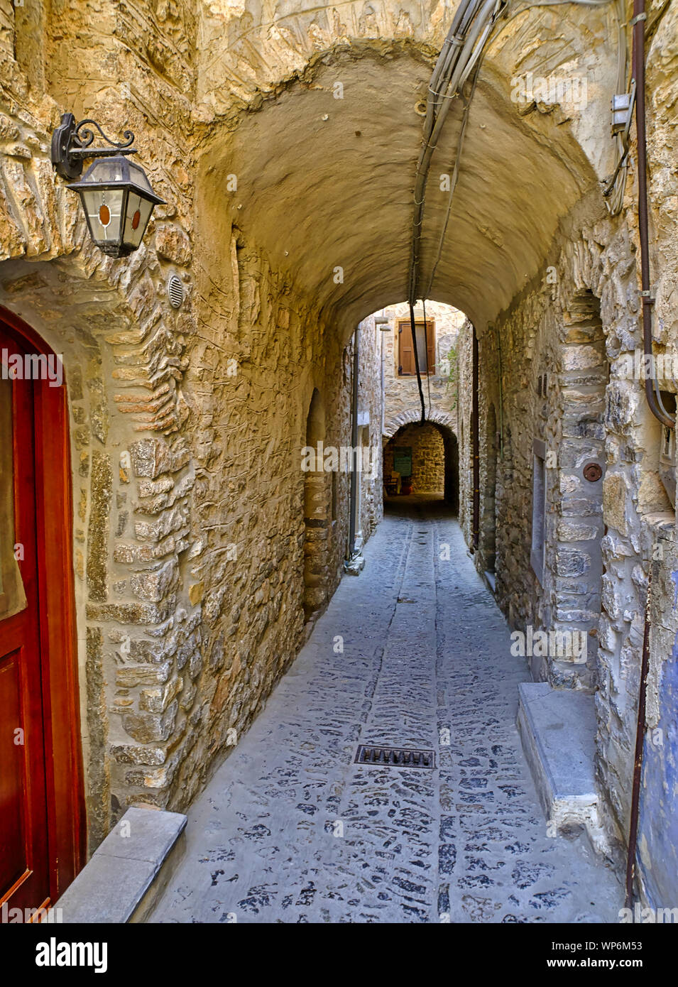 Narrow alley at the medieval castle village of Mesta in Chios island ...
