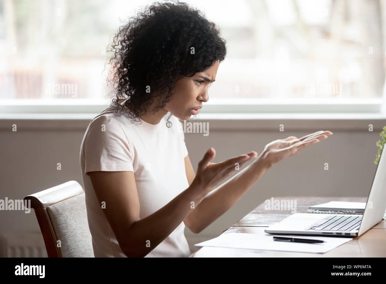 African american woman computer mad hi-res stock photography and images ...