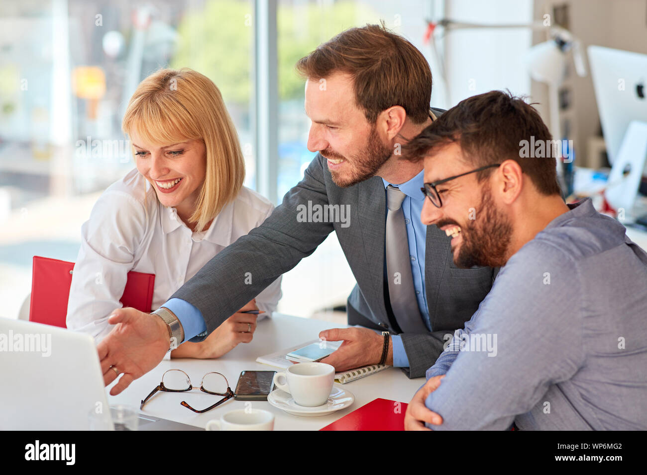 Business Consultation. Smiling business people working together on ...