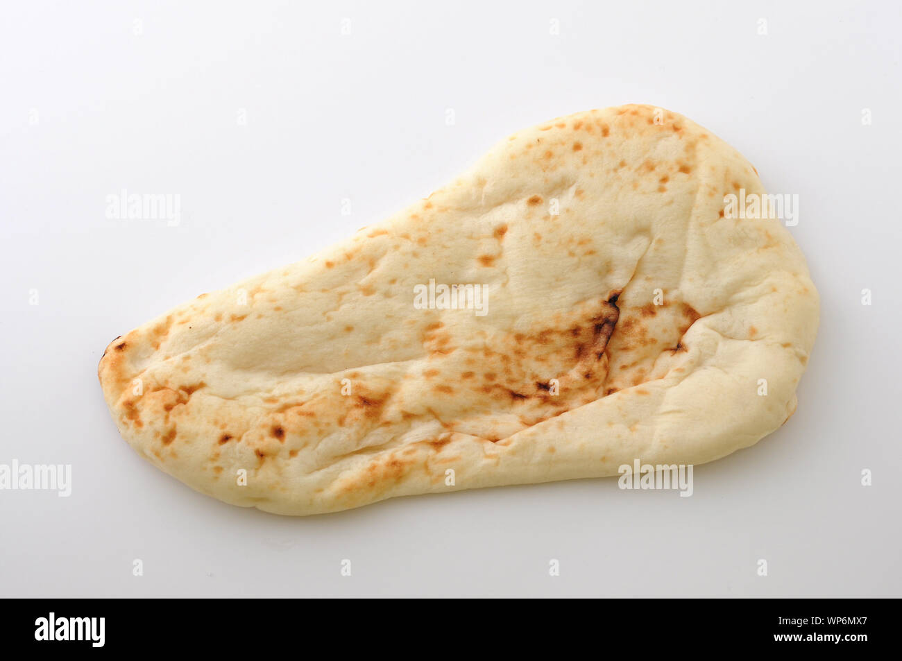 naan indian bread closeup isolated on white background Stock Photo - Alamy