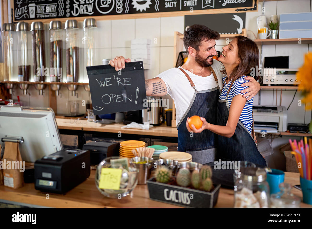 we are open –Happy business owner opening their cafe store Stock Photo ...