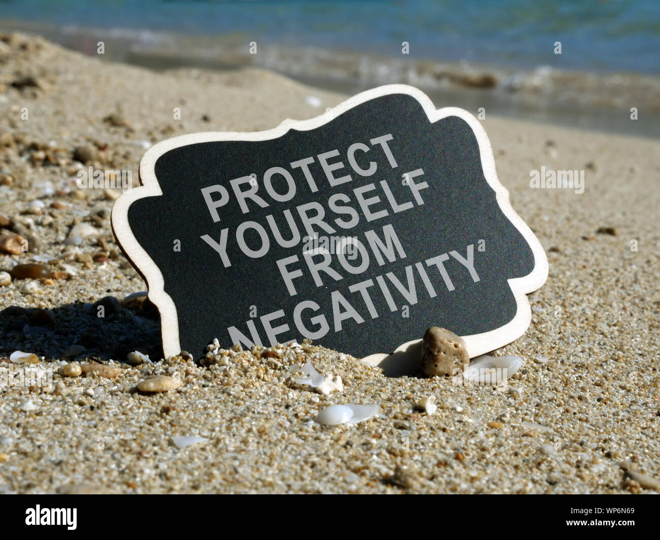 Plate with sign Protect Yourself from Negativity Stock Photo - Alamy