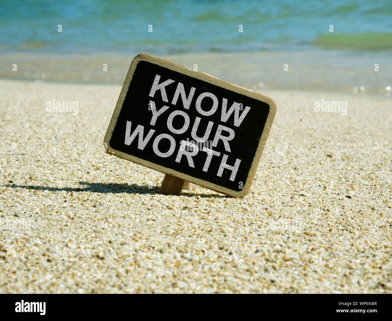 Know your worth sign on the plank. Personal value concept Stock Photo ...