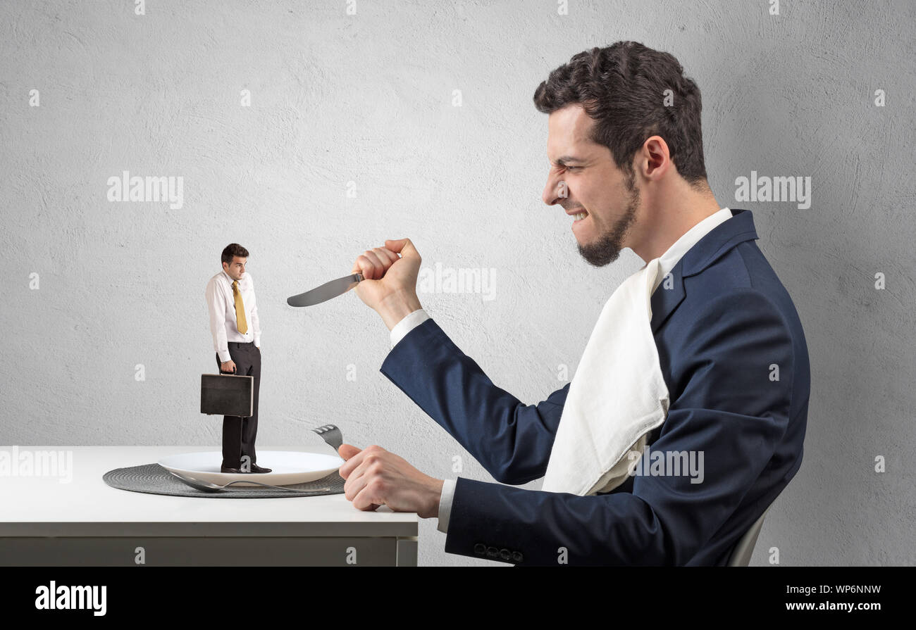 Tiny scared weak businessman almost devoured by great power Stock Photo ...
