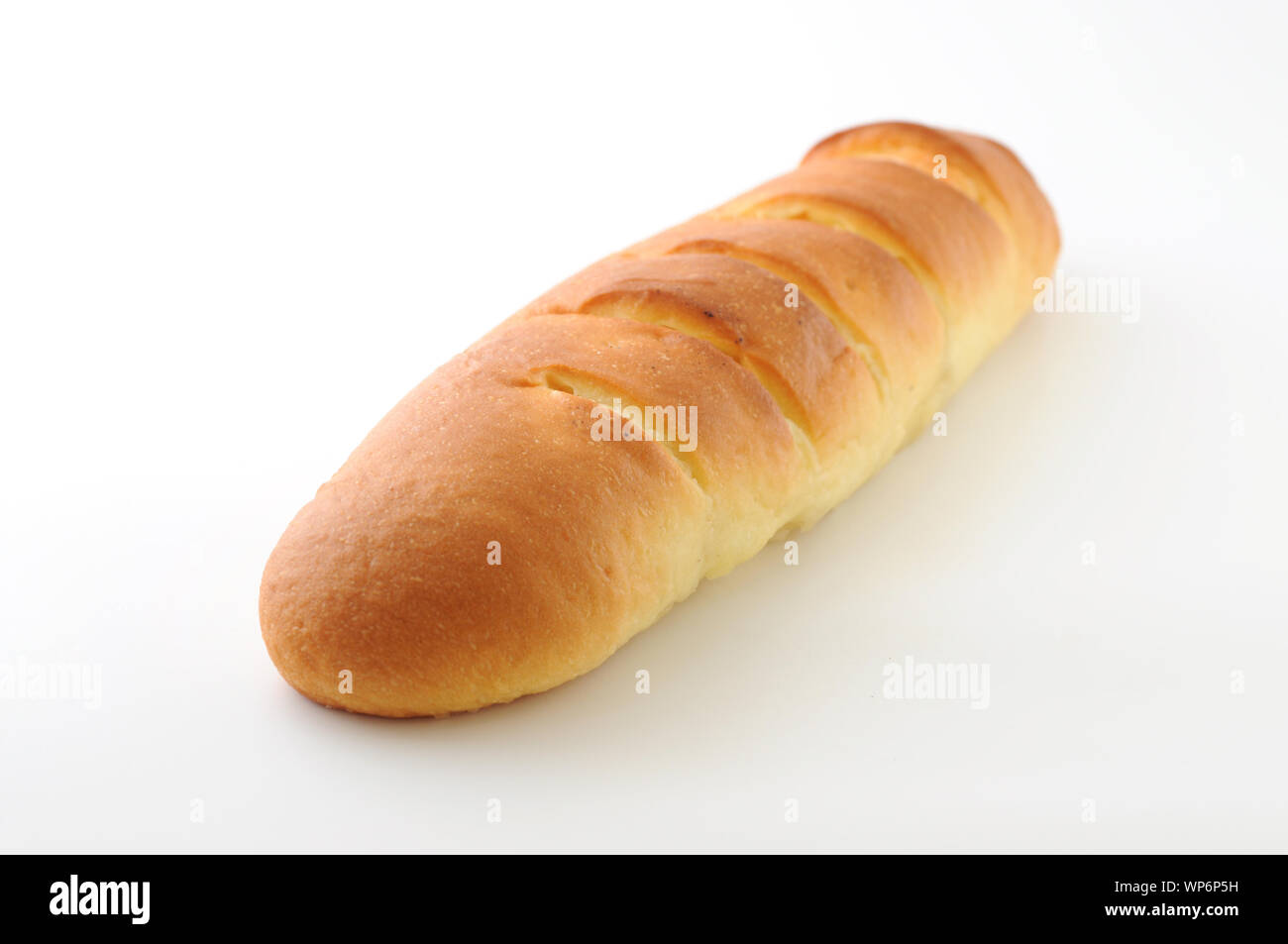 long butter bread closeup isolated on white background Stock Photo - Alamy
