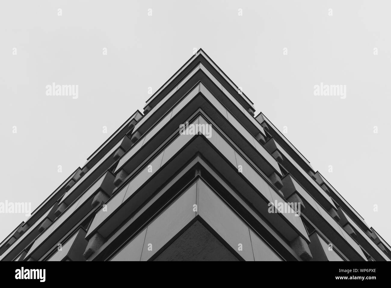 Low angle shot of a grey concrete building representing modern ...