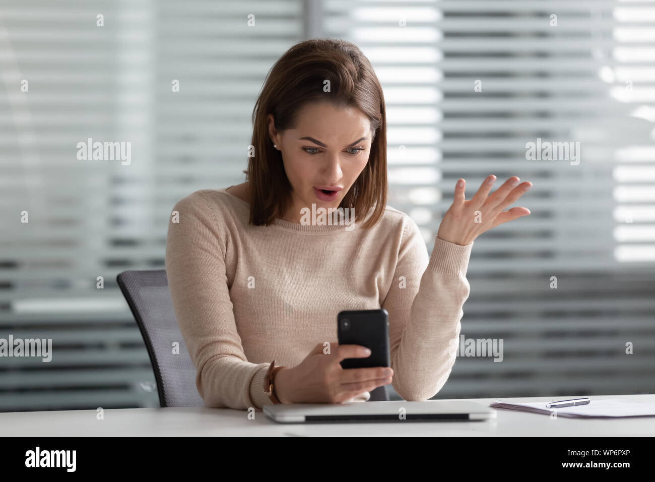 Outraged young female employee annoyed by poor internet connection ...