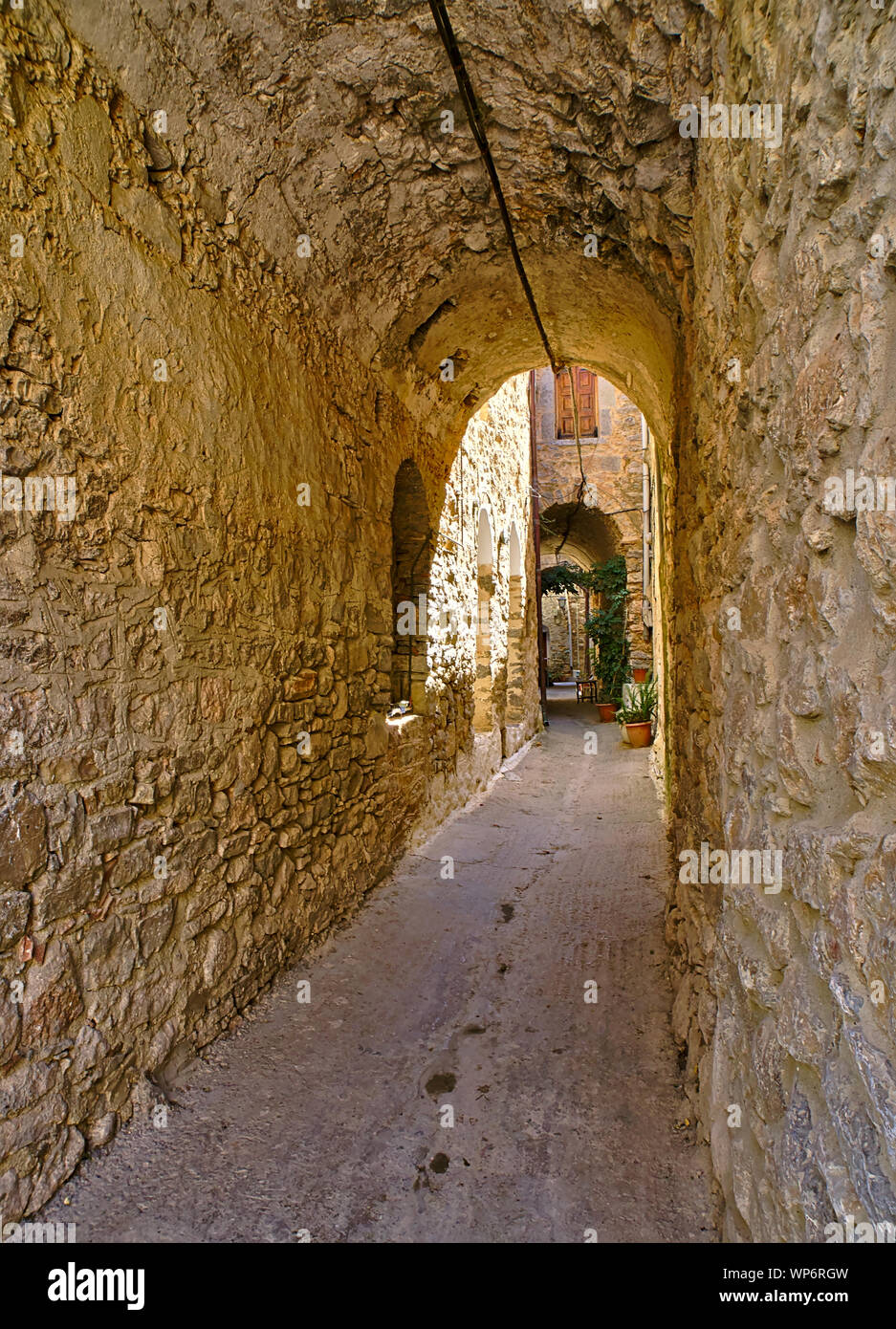 Narrow alley at the medieval castle village of Mesta in Chios island ...