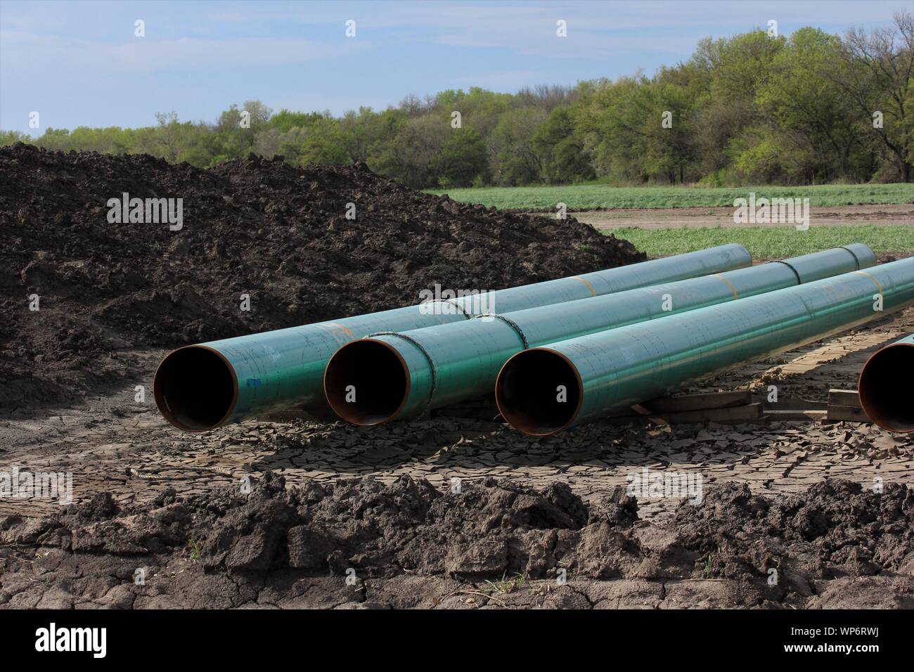 Natural Gas pipes in a farm field with tree's and dirt in Kansas Stock ...