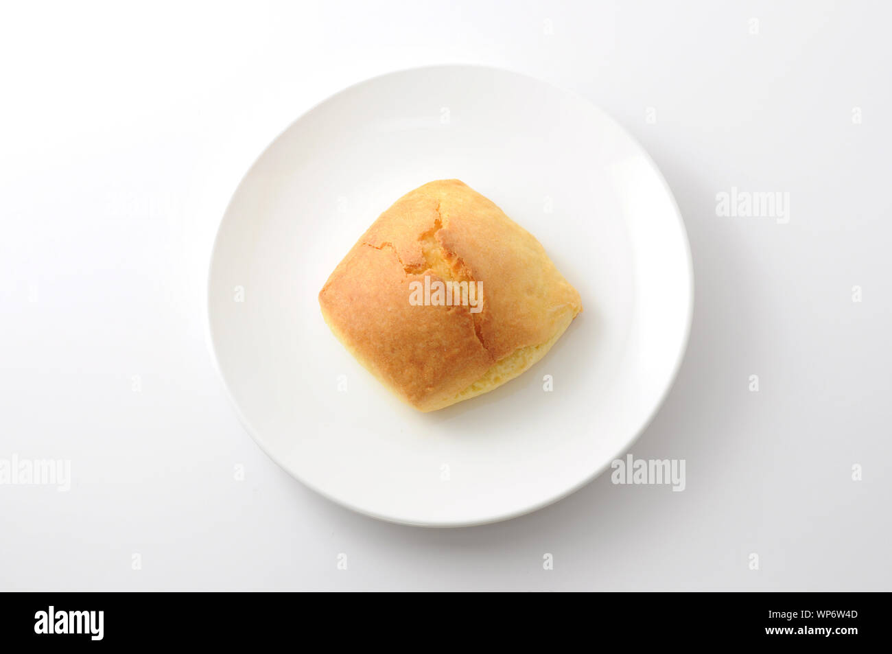 scone on plate closeup isolated on white background Stock Photo - Alamy