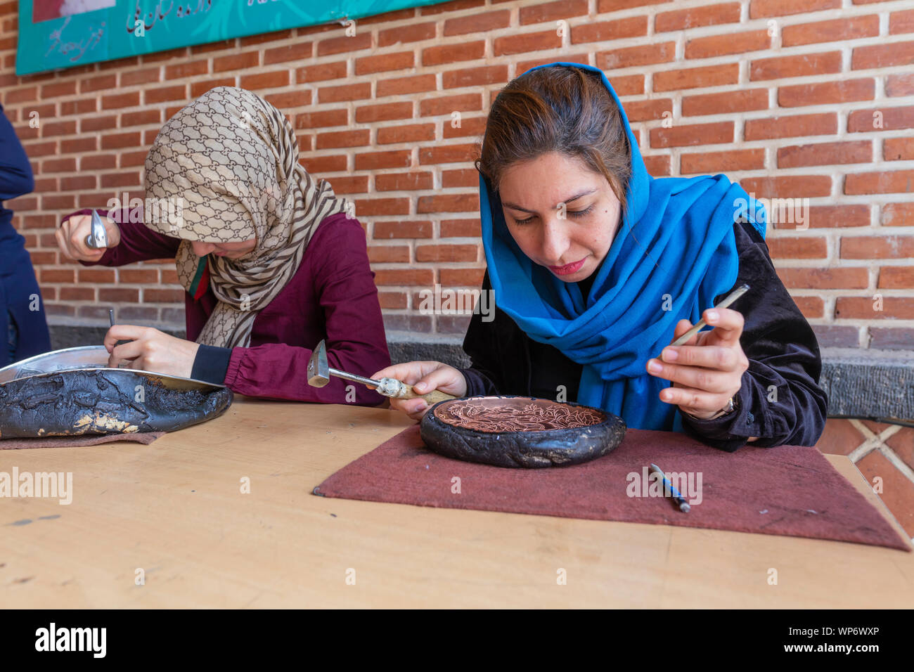 Girls working with traditional metal chasing, Sheikh Safi-ad-din ...